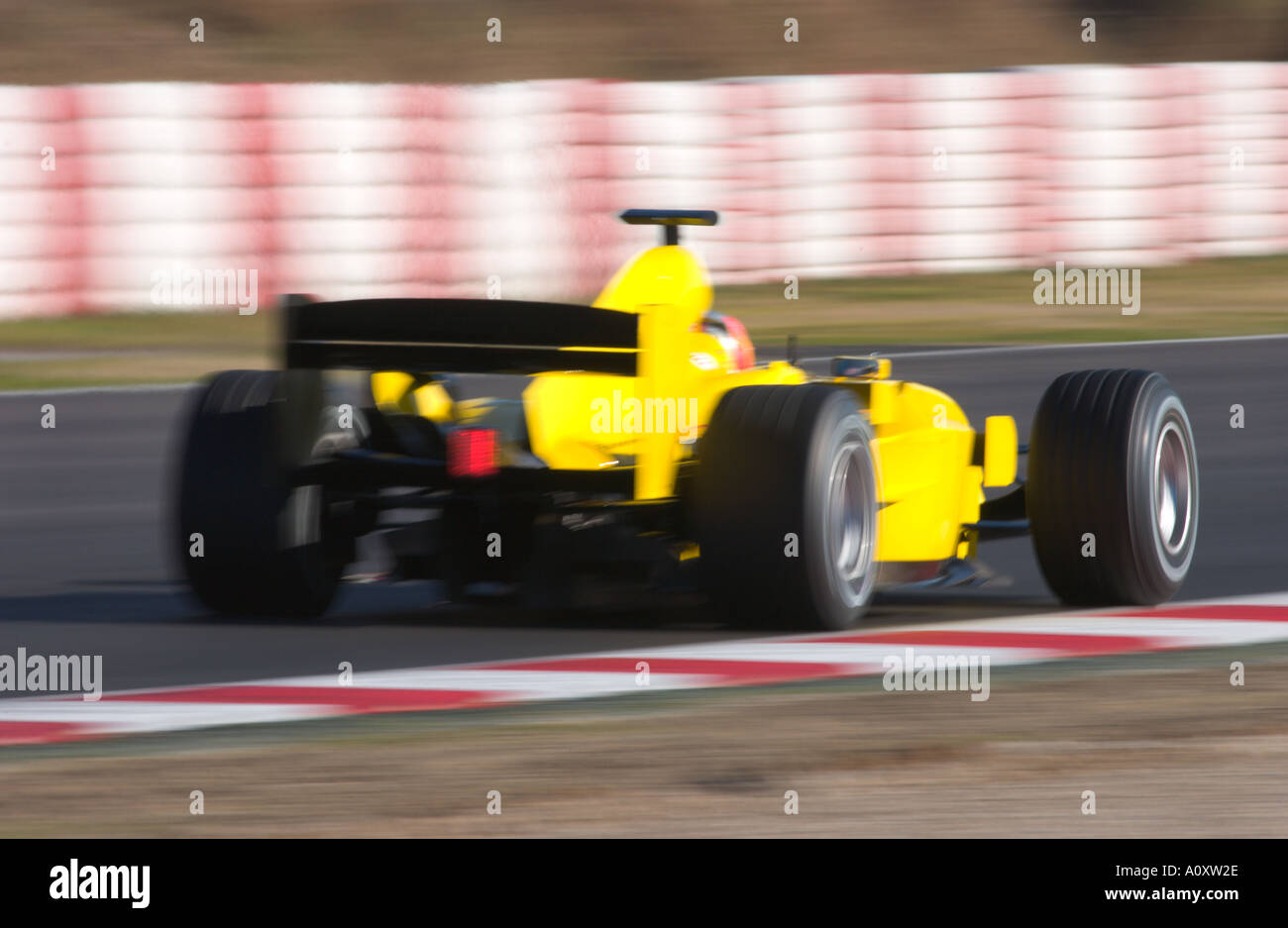 yellow Formula One racecar on the track in 2005 Stock Photo - Alamy