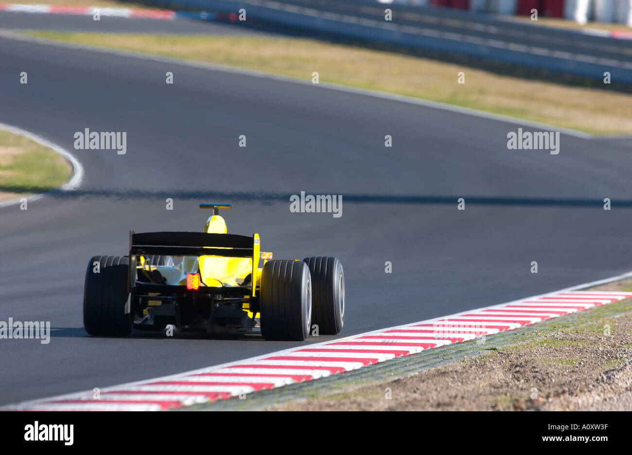 yellow Formula One racecar on the track in 2005 Stock Photo - Alamy