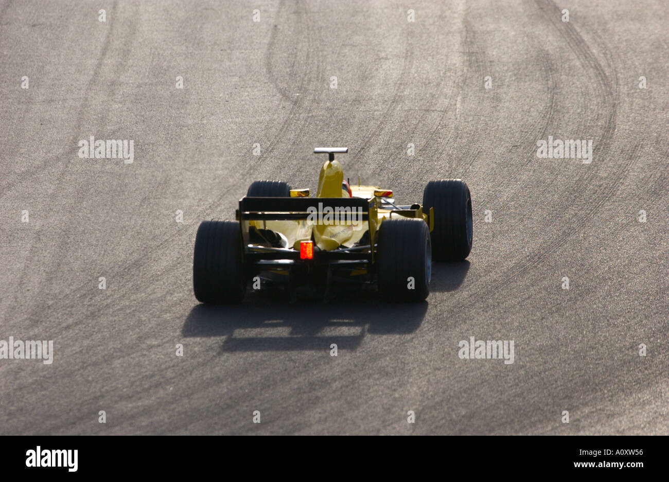 yellow Formula One racecar on the track in 2005 Stock Photo - Alamy