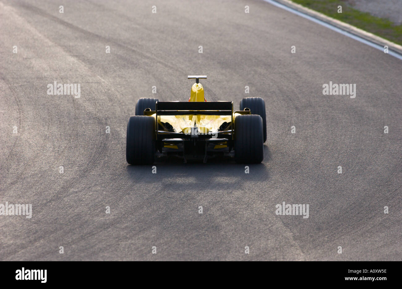 yellow Formula One racecar on the track in 2005 Stock Photo - Alamy