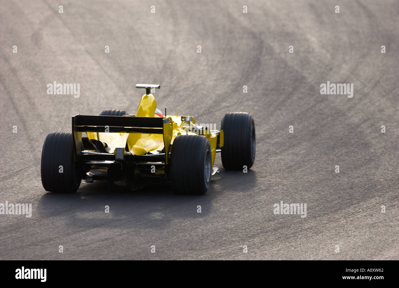 yellow Formula One racecar on the track in 2005 Stock Photo - Alamy