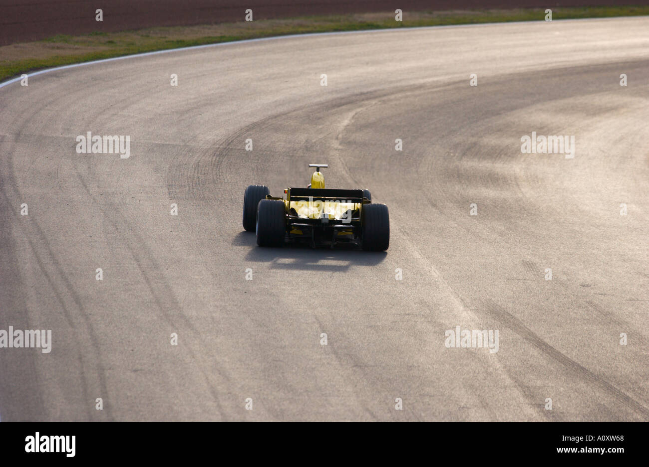 yellow Formula One racecar on the track in 2005 Stock Photo - Alamy