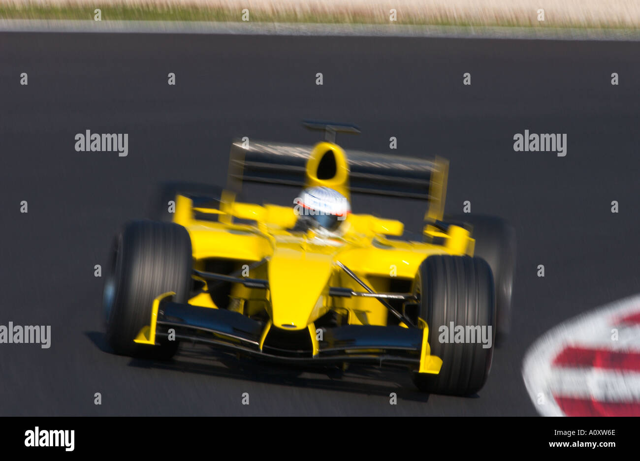yellow Formula One racecar on the track in 2005 Stock Photo - Alamy