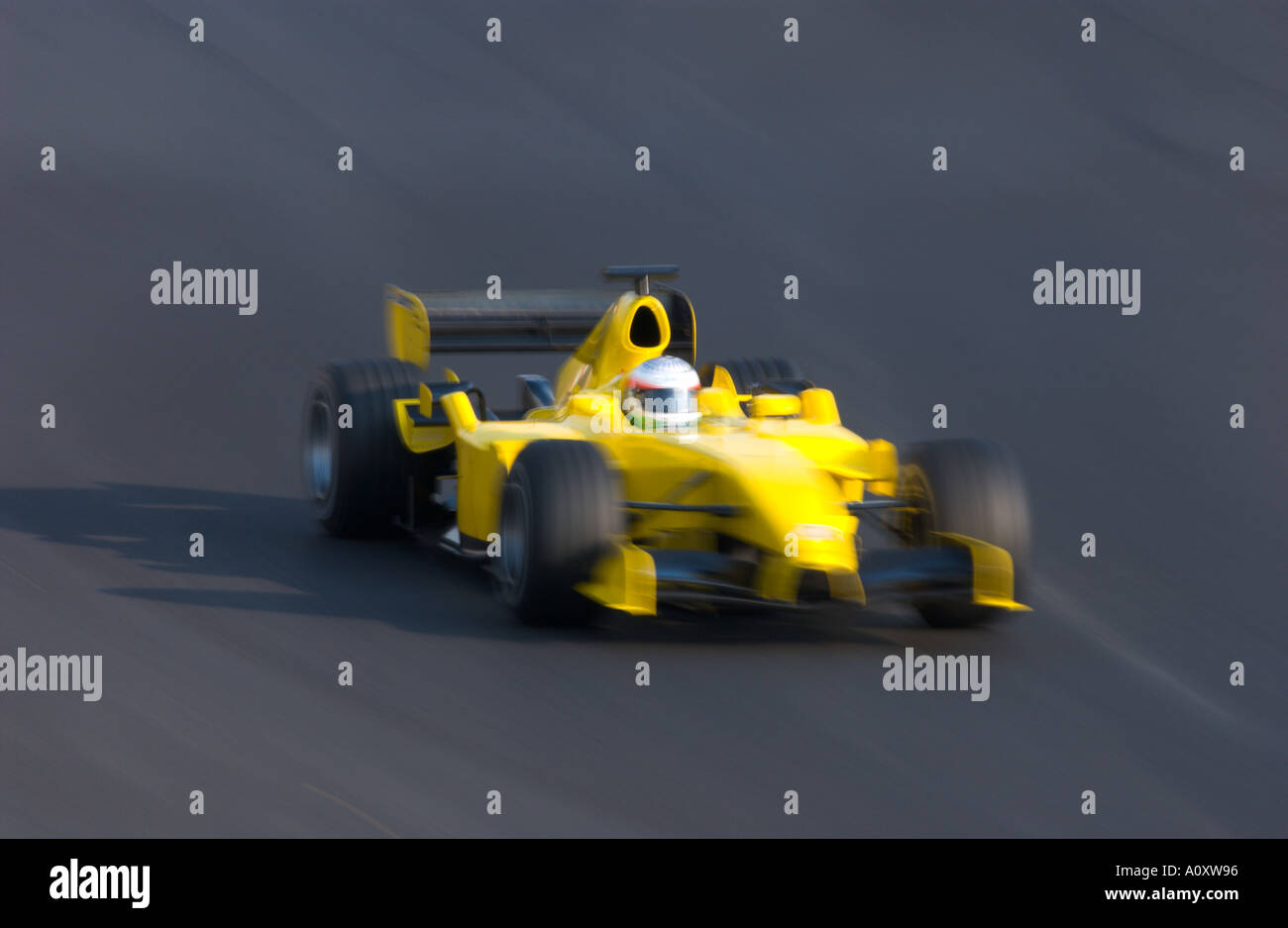 yellow Formula One racecar on the track in 2005 Stock Photo - Alamy