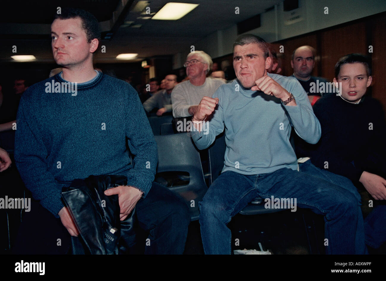 United Kingdom, England, London, Boxing fans ringside at the famous ...