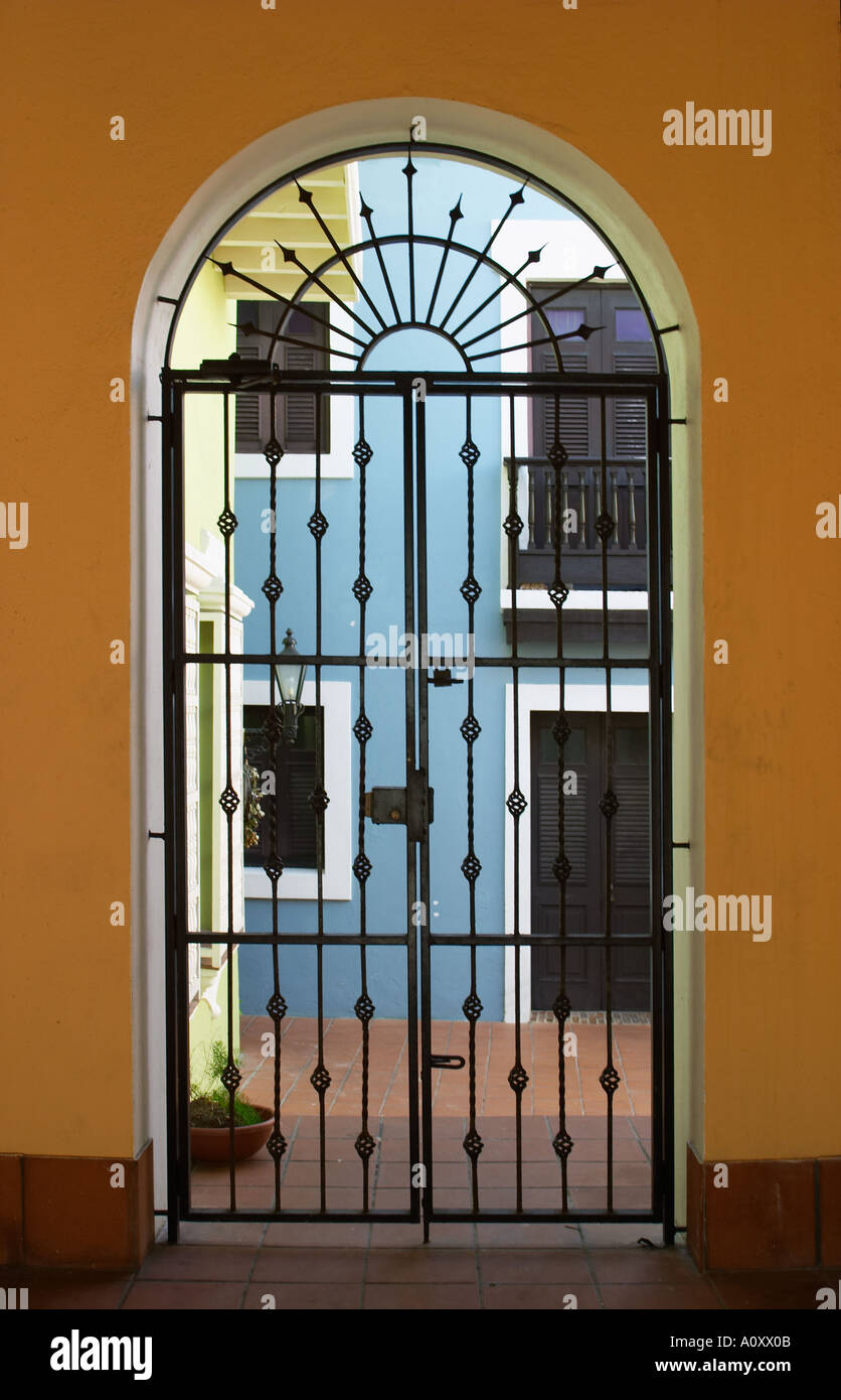 PUERTO RICO San Juan Arched wrought iron gate entry to apartment plaza ...