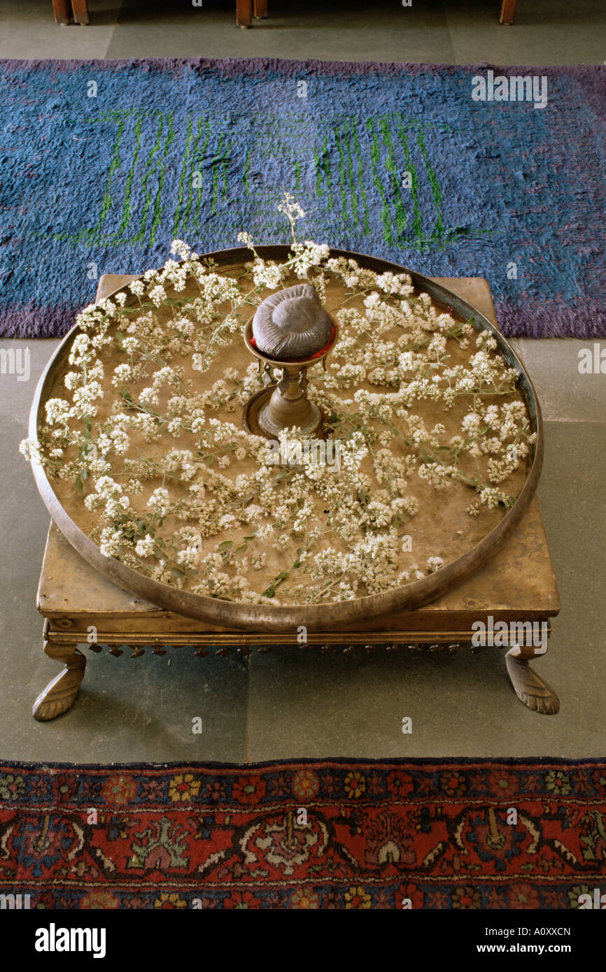 Flower arrangement in traditional brass thali in a residence Ahmedabad ...