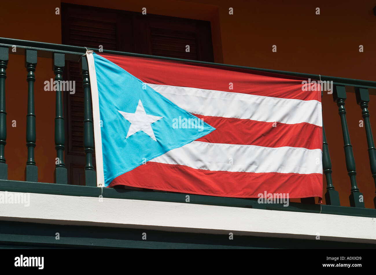 PUERTO RICO San Juan Puerto Rican flag hanging on balcony railing Stock ...