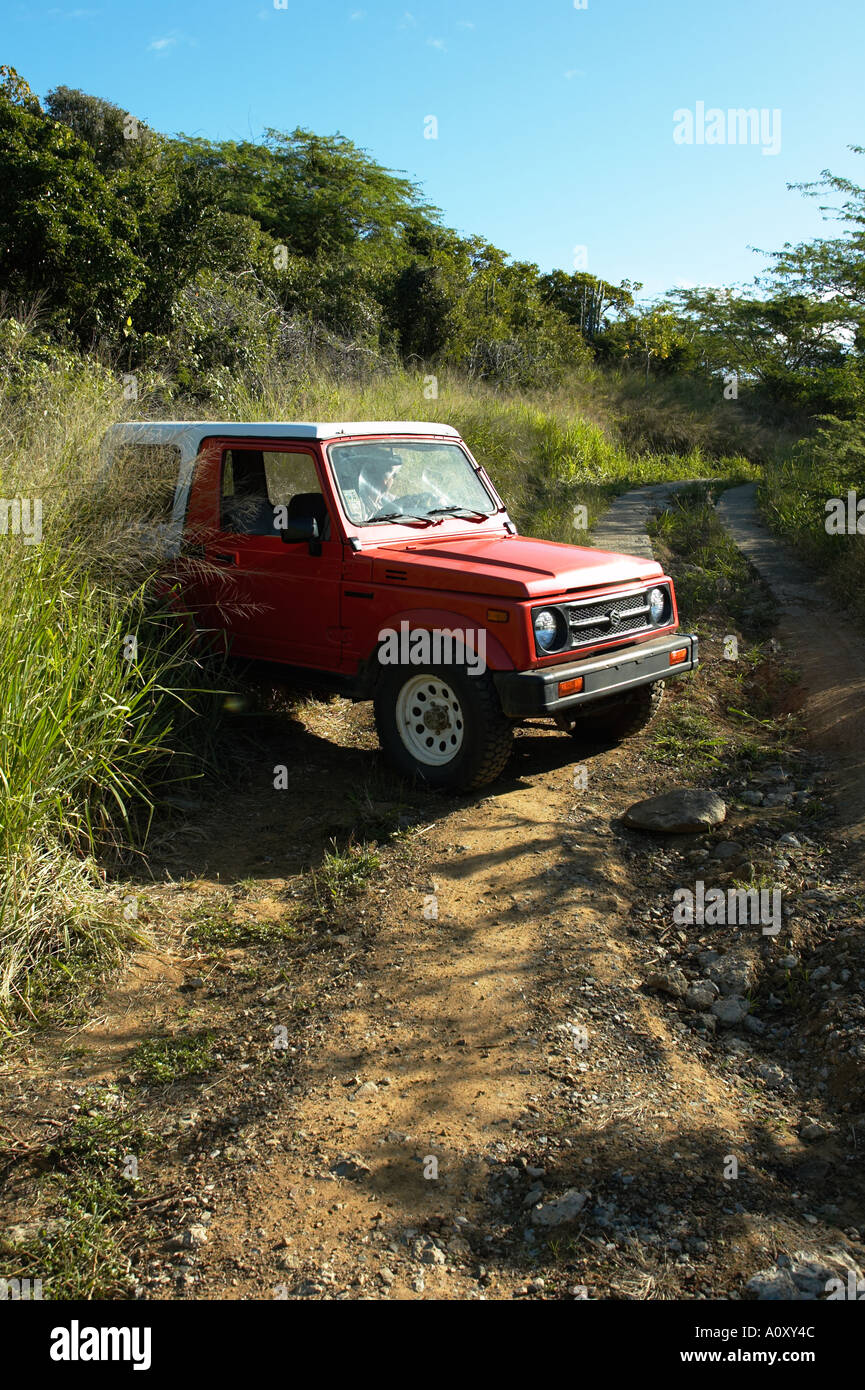 PUERTO RICO Culebra Small SUV on rough and narrow roads interior of ...