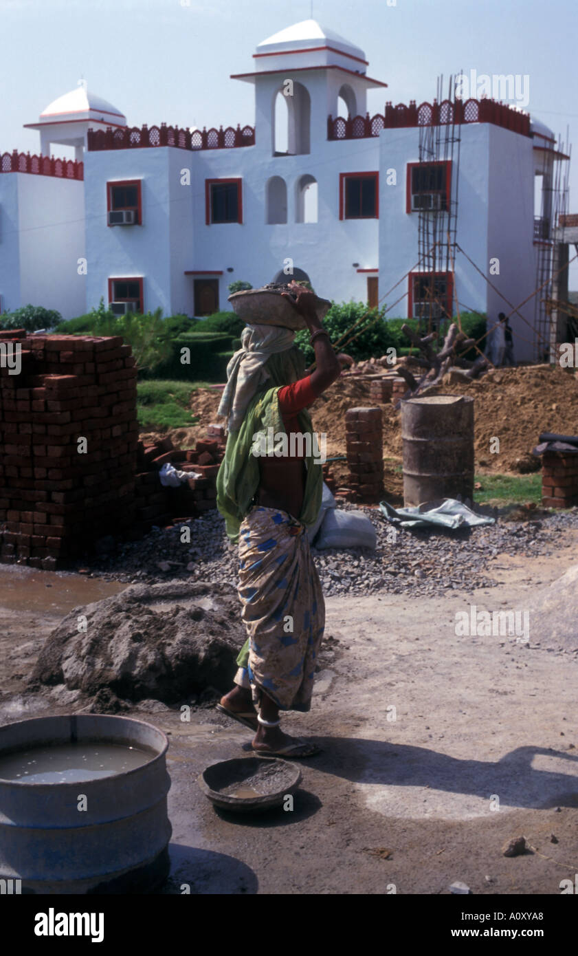 Indian female worker working as a laborer on a construction site Stock ...