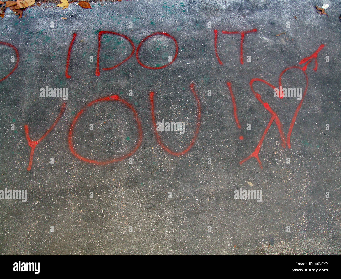 one single red heart painted on road Stock Photo - Alamy