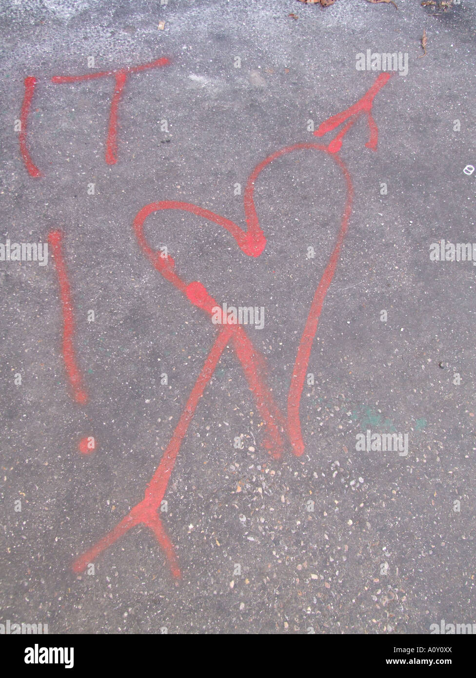 one single red heart painted on road Stock Photo - Alamy