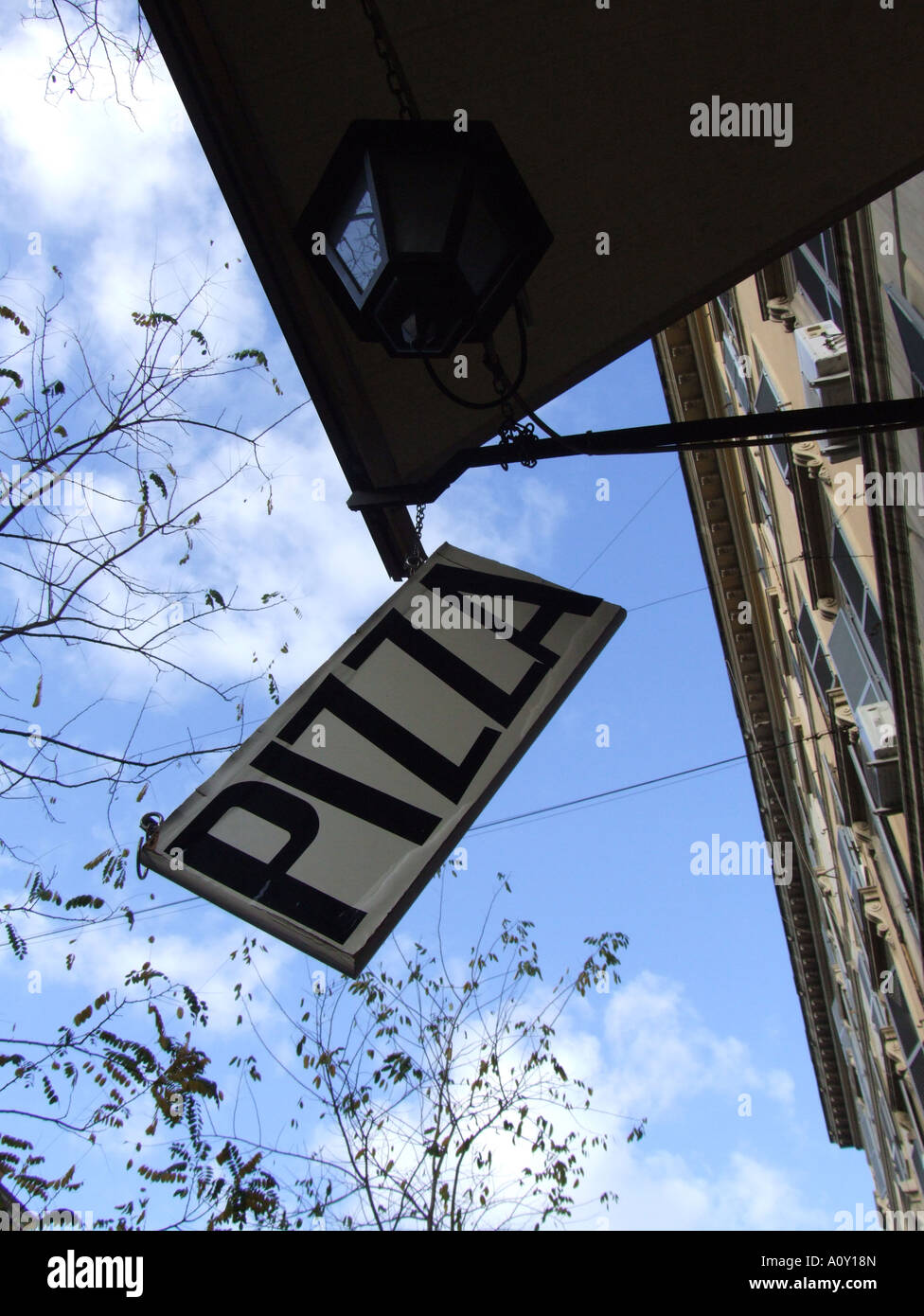 a pizza sign hanging outside shop Stock Photo - Alamy