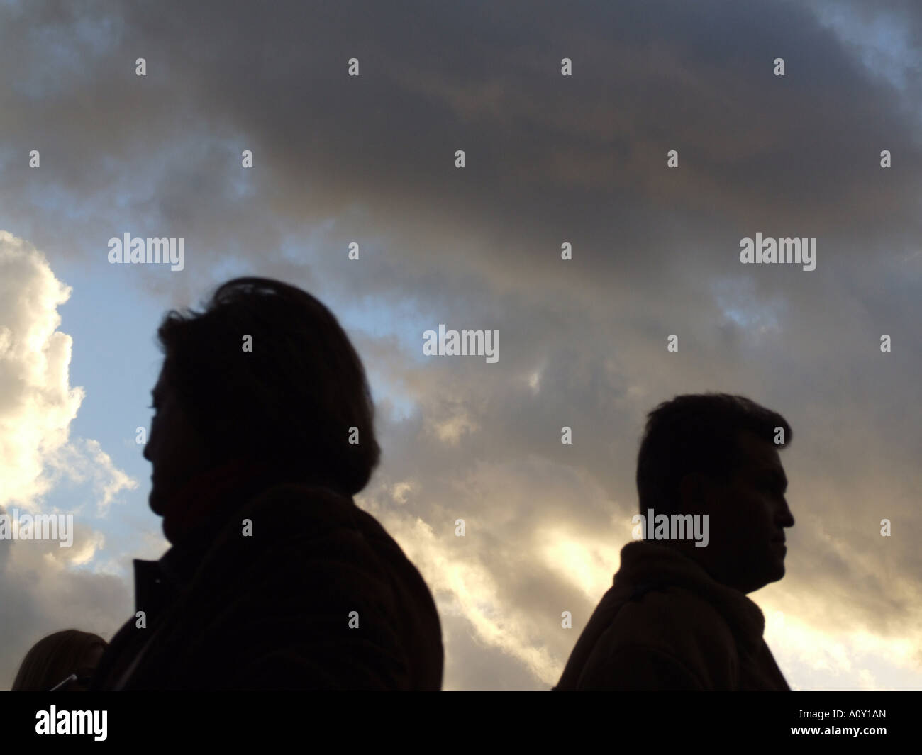 backlit people against dramatic sky Stock Photo - Alamy