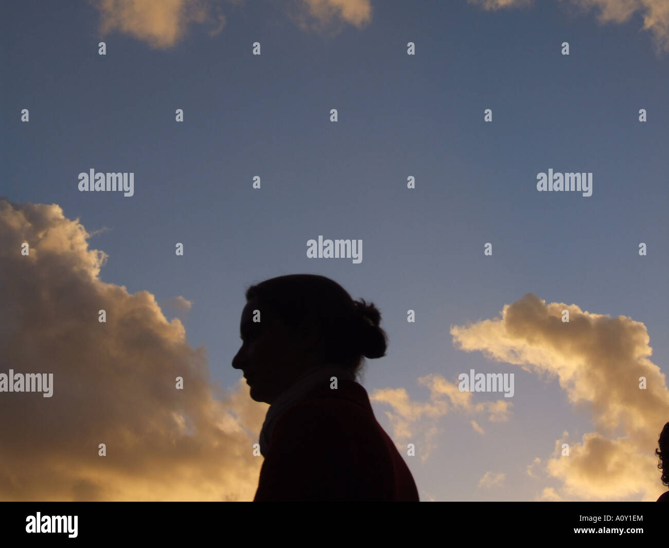 backlit person against dramatic sky Stock Photo - Alamy