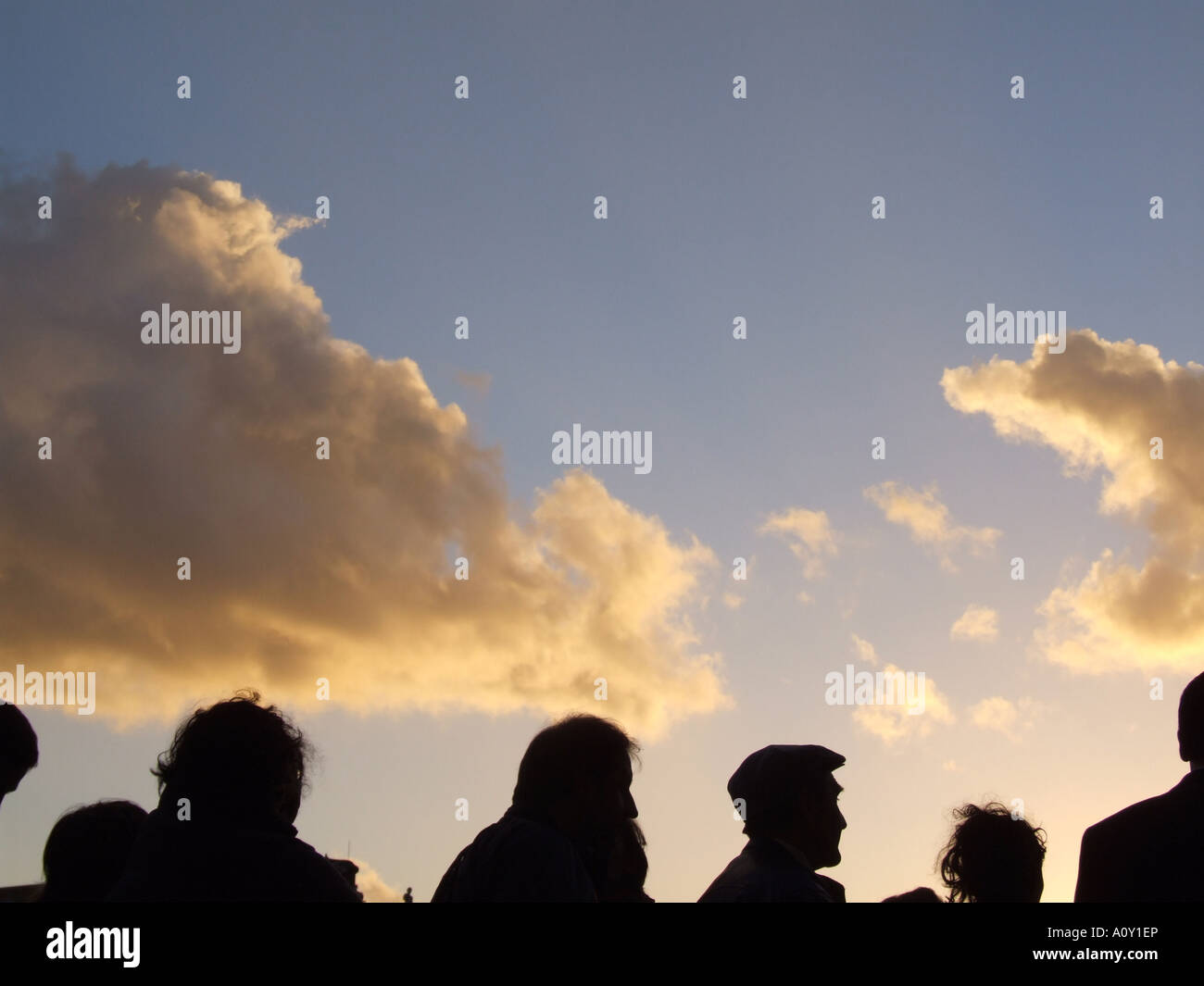 backlit people against dramatic sky Stock Photo - Alamy