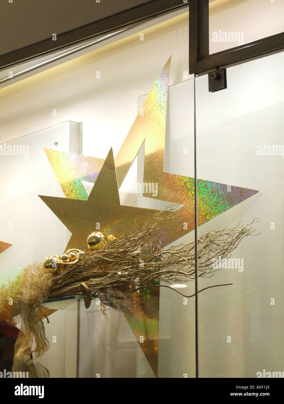 gold stars in shop window display Stock Photo - Alamy