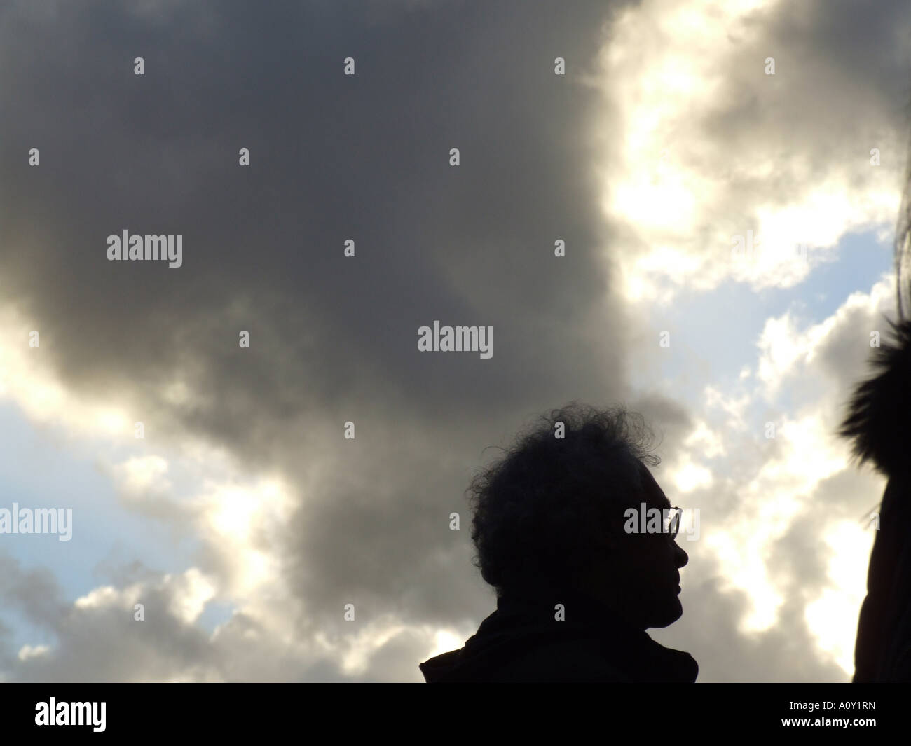 backlit people against dramatic sky Stock Photo - Alamy