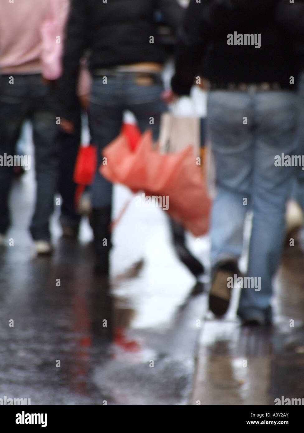 person carrying umbrella in town Stock Photo - Alamy