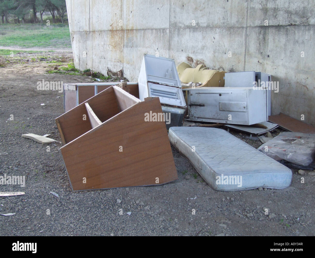 old household items dumped on derelict ground Stock Photo - Alamy