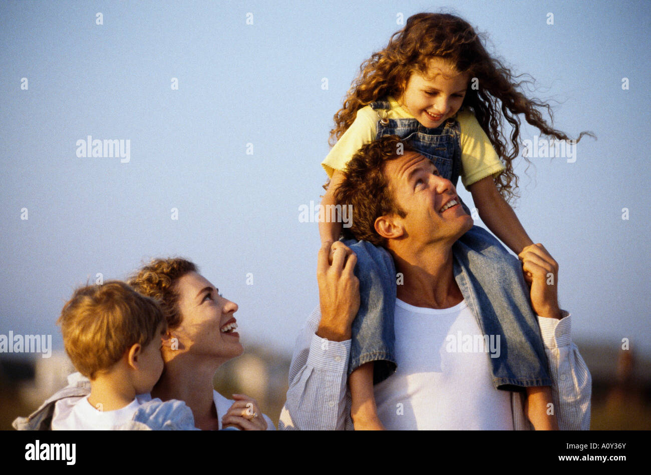 Parents smiling with their children Stock Photo - Alamy