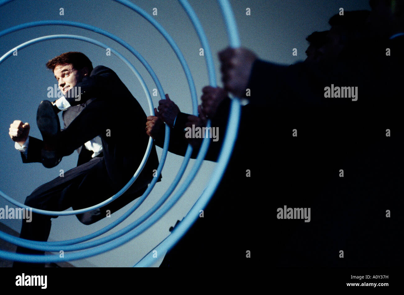 Businessman jumping through hoop hi-res stock photography and images ...