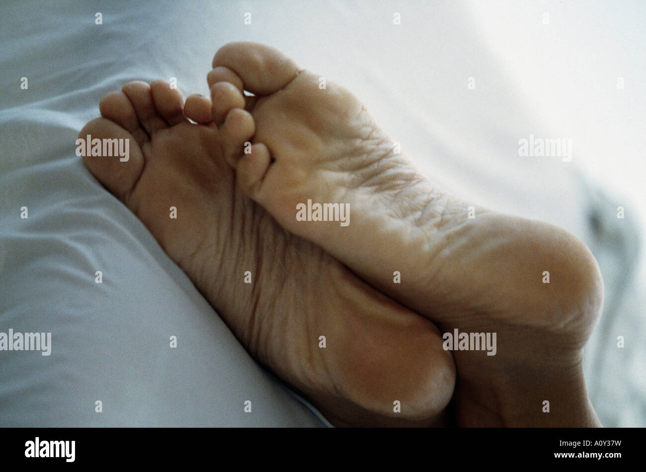 Close up crossed legs feet hi-res stock photography and images - Alamy
