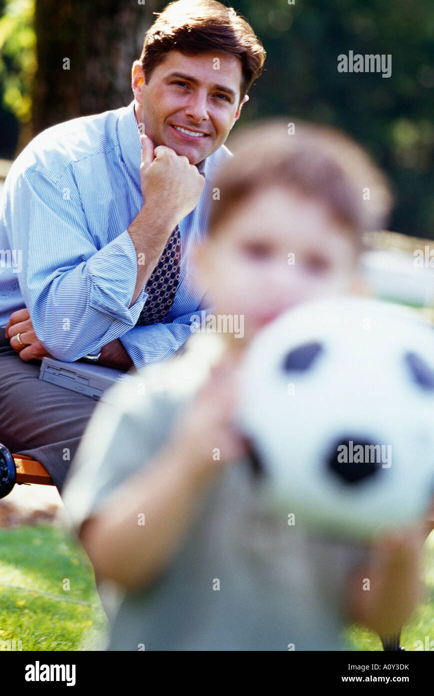 Portrait of a father looking at his son Stock Photo - Alamy