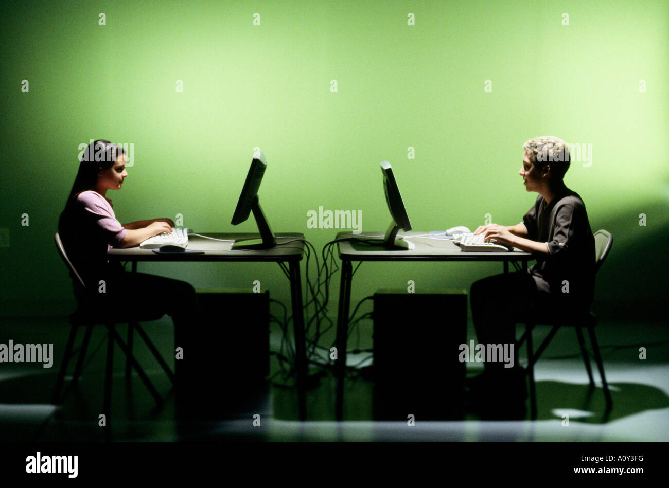 Side profile of a teenage girl and a teenage boy using computers Stock ...