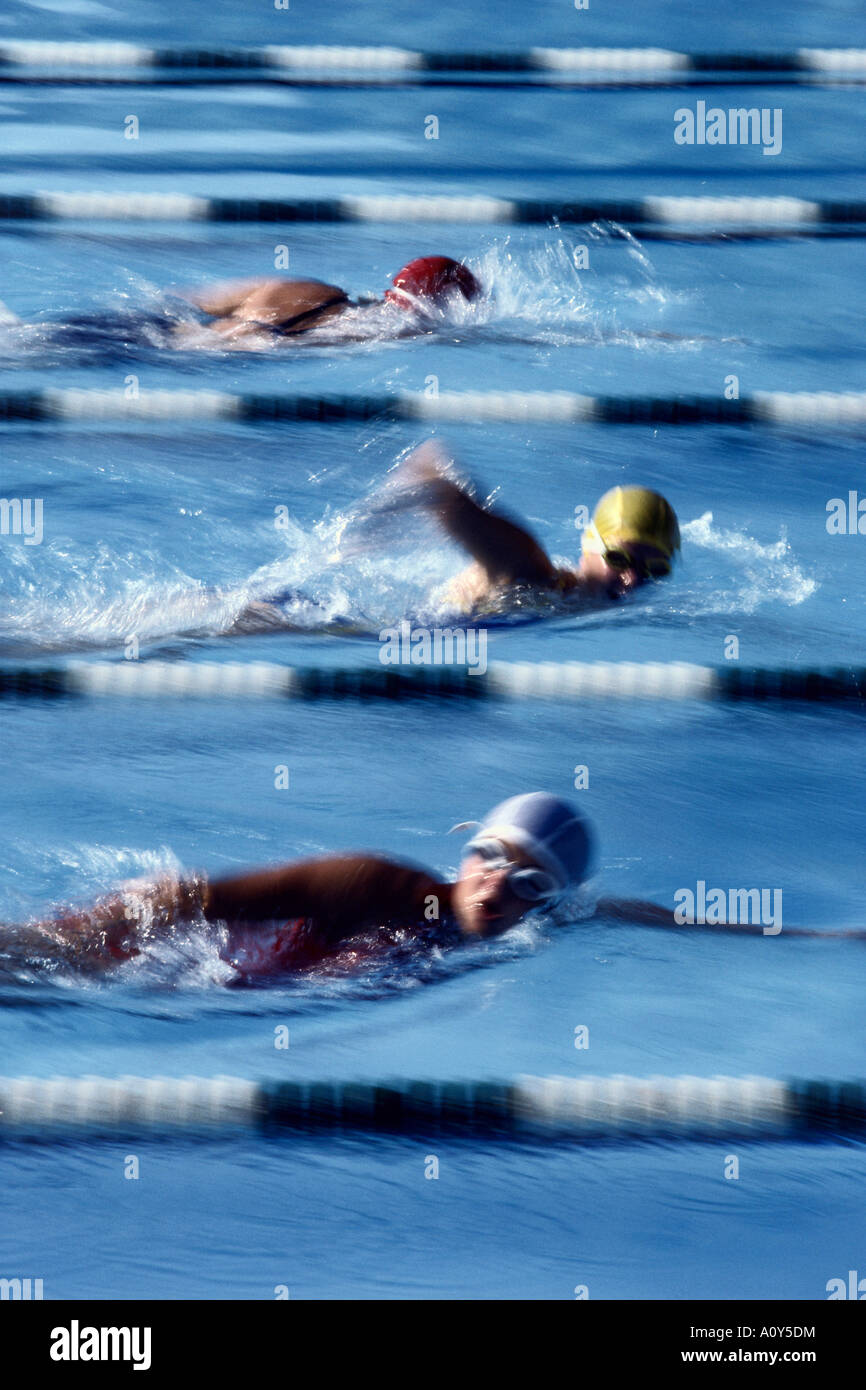 Side profile of three people swimming Stock Photo - Alamy
