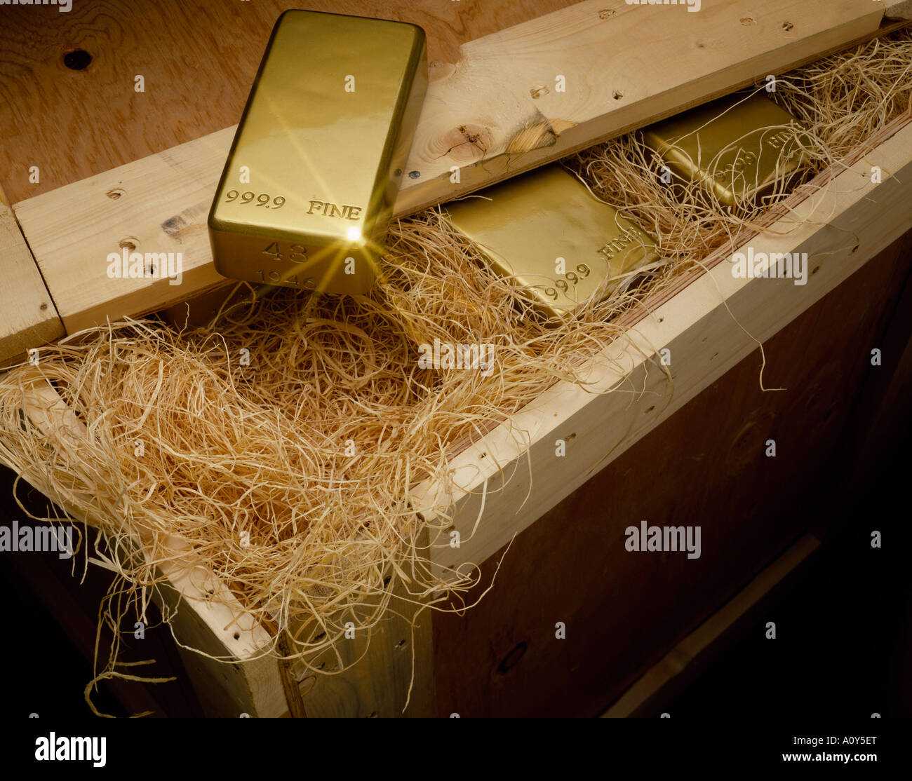 High angle view of a gold bar on a wooden plank Stock Photo - Alamy