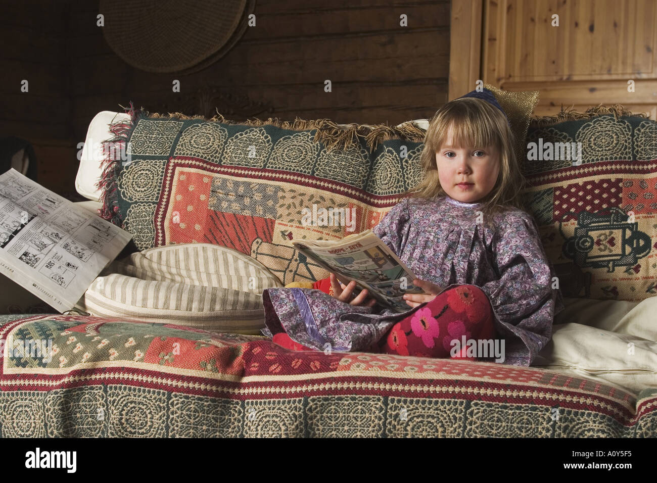 Girl reading comic couch hi-res stock photography and images - Alamy