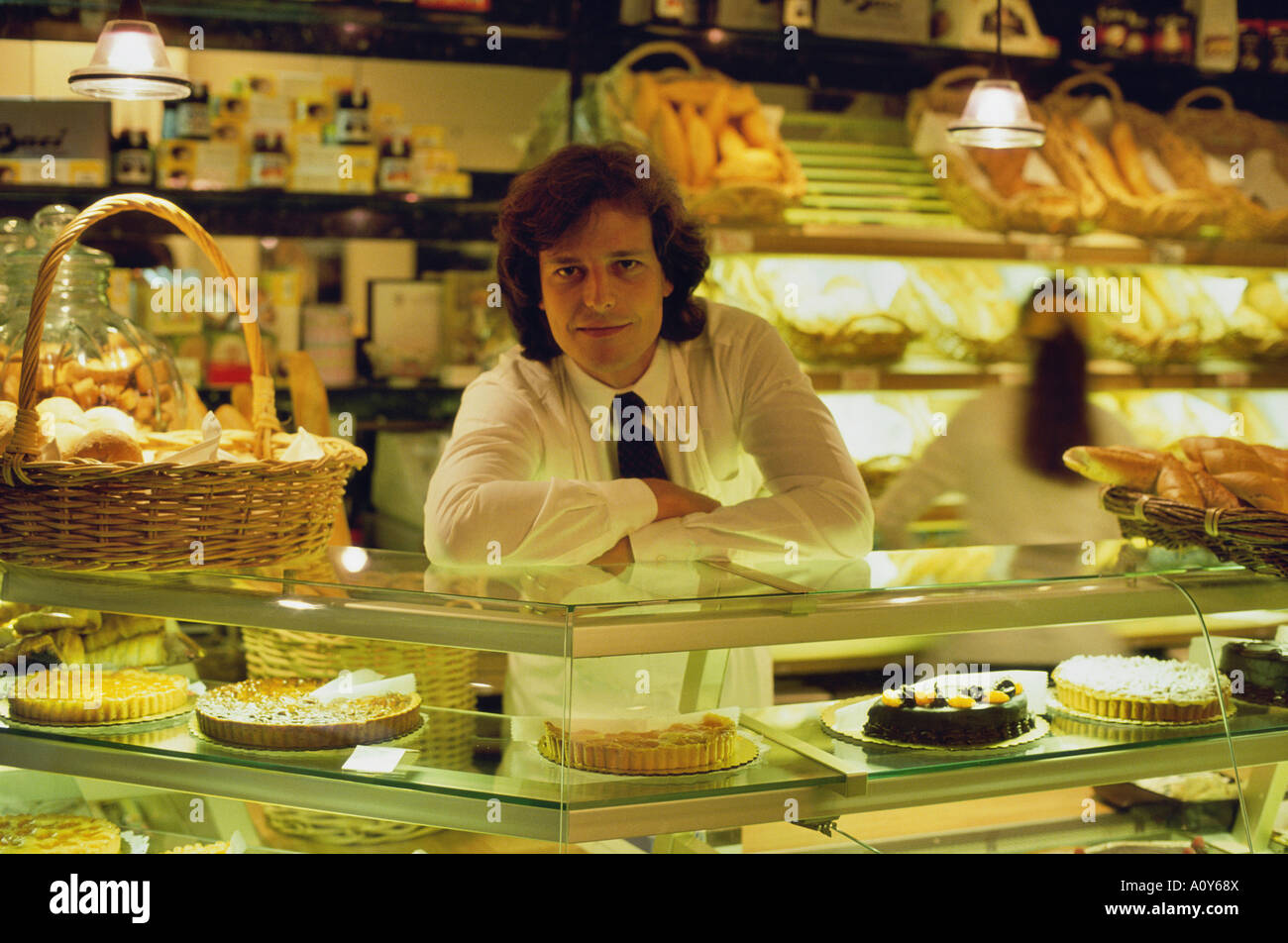 Portrait of a baker standing in a bakery Stock Photo - Alamy