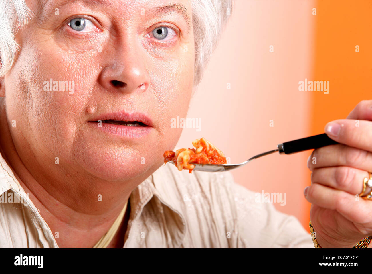 Mature Woman Eating Spicy Chickpeas Model Released Stock Photo - Alamy