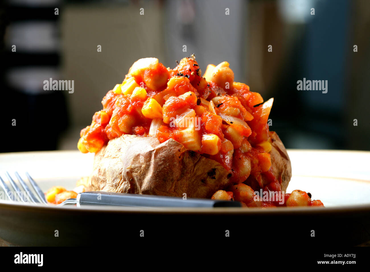 Jacket Potato with Spicy Chickpeas Stock Photo - Alamy