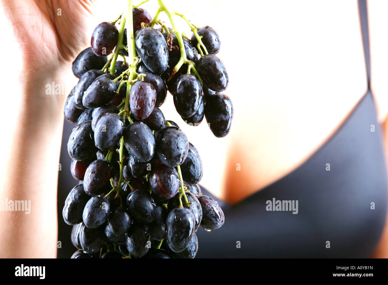 Young Woman Eating Red Grapes Model Released Stock Photo - Alamy