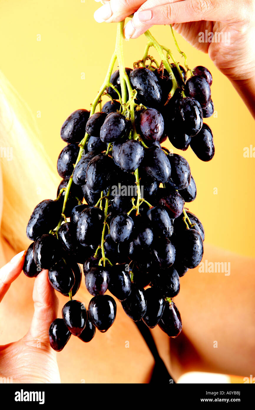 Young Woman Eating Red Grapes Model Released Stock Photo - Alamy