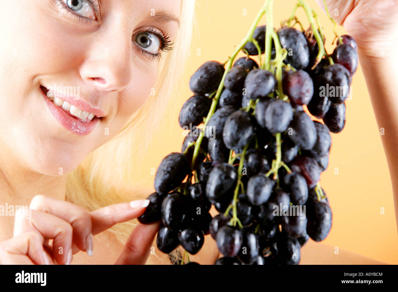 Young Woman Eating Red Grapes Model Released Stock Photo - Alamy