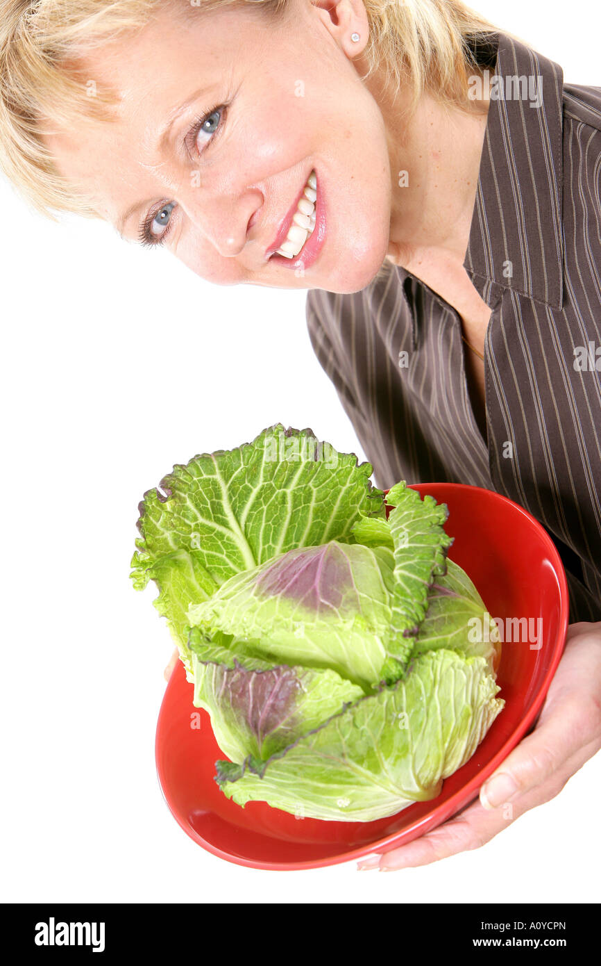 Mature Woman Holding Cabbage on a Plate Model Released Stock Photo - Alamy