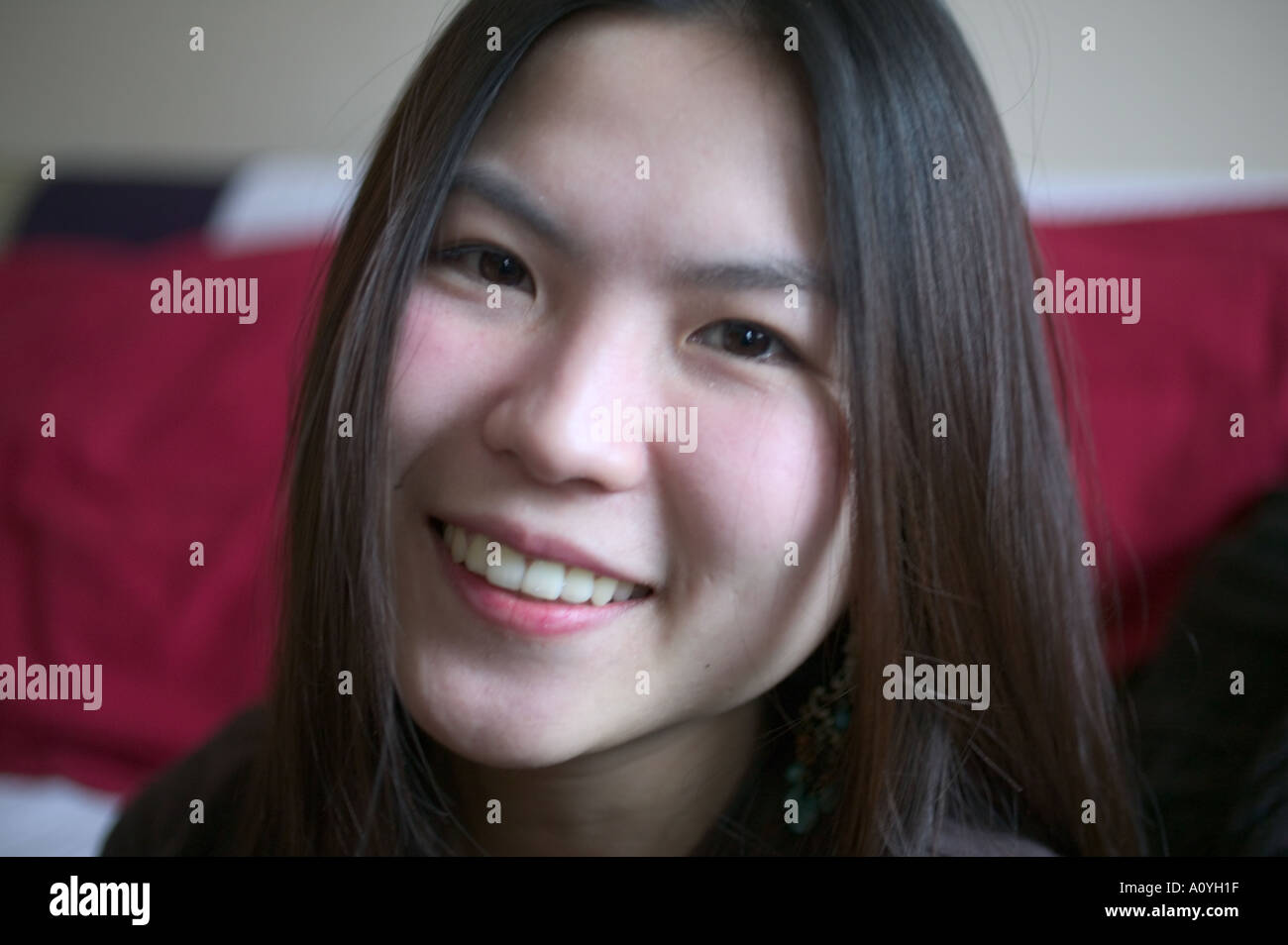 Asian female smiling to camera Stock Photo - Alamy