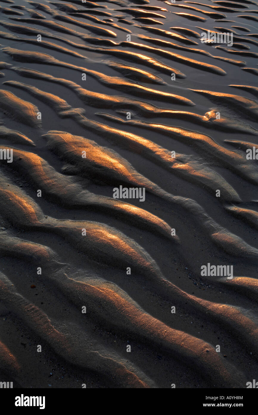 Sand patterns at sunrise on Sandbanks beach Bournemouth Beaches Stock ...