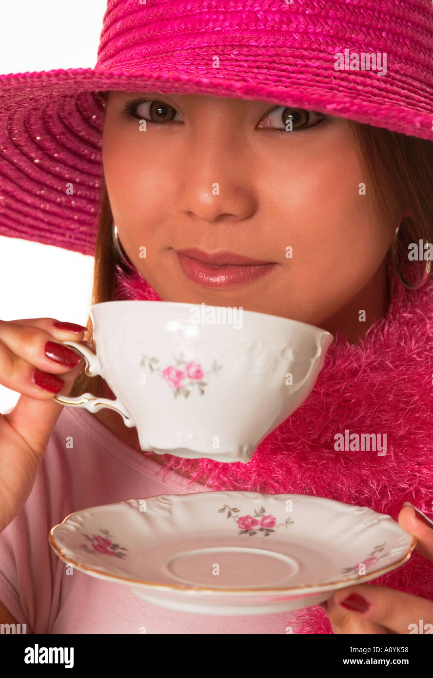 Pretty Asian Teen Girl Sipping Tea USA Stock Photo - Alamy