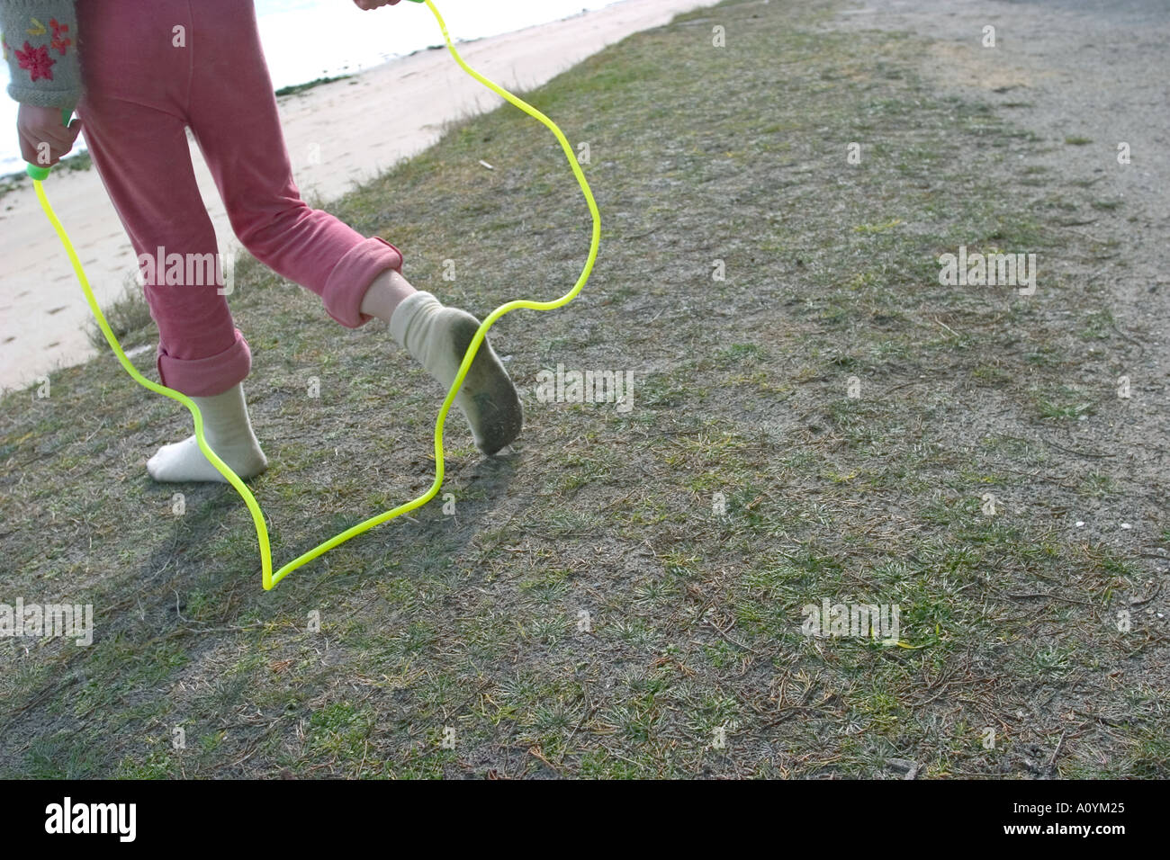 Child pink skipping rope hi-res stock photography and images - Alamy