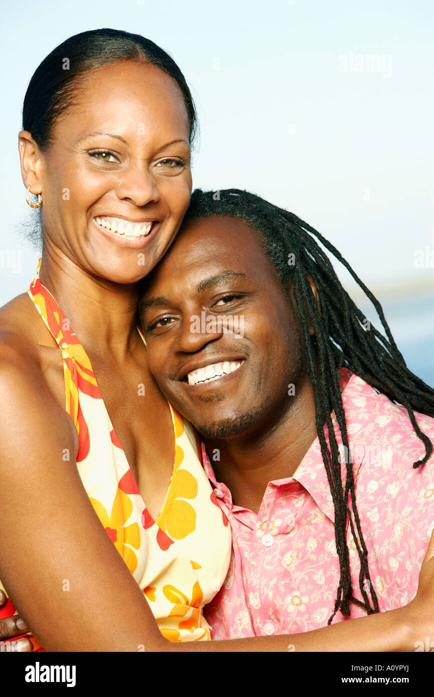 Young African couple hugging Stock Photo - Alamy