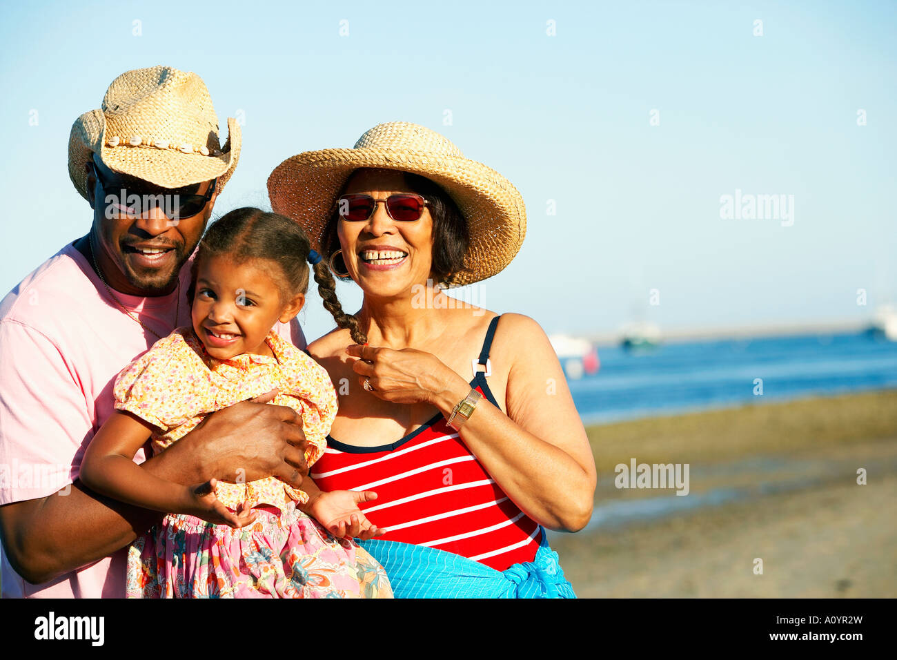 African family smiling on the beach Stock Photo - Alamy