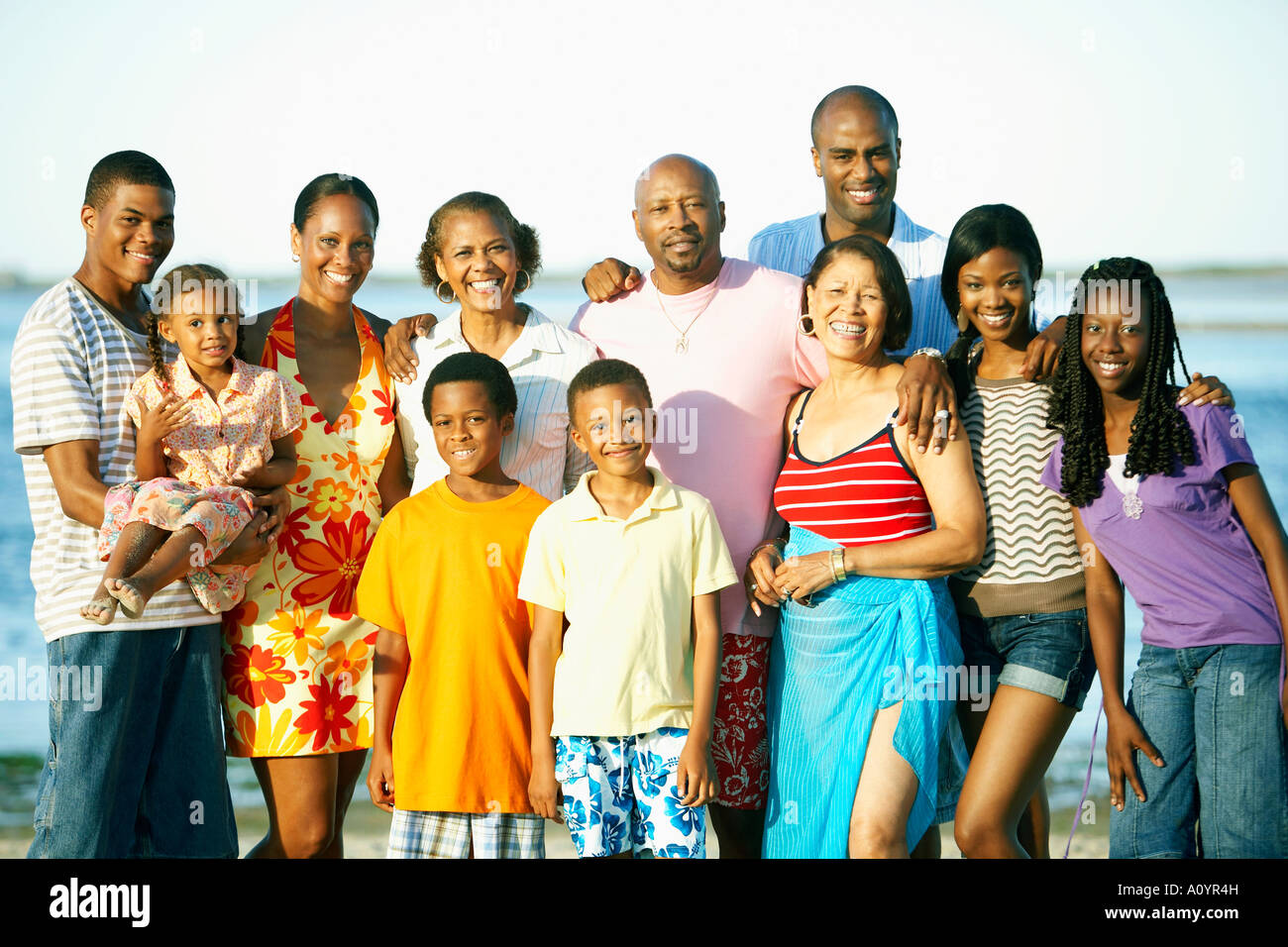 Extended African family smiling on the beach together Stock Photo - Alamy
