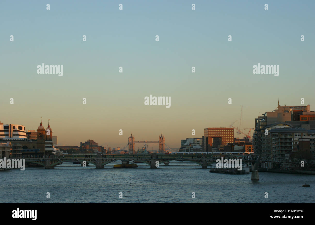 Evening view east along the Thames toward Tower bridge Stock Photo - Alamy