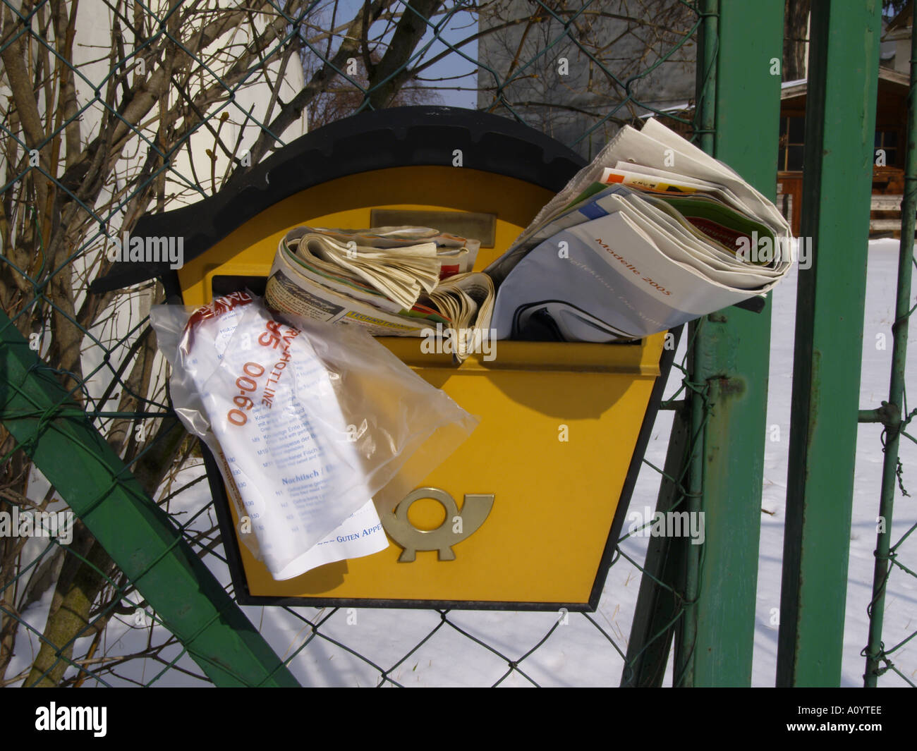 letter box, stuffed with advertising material Stock Photo - Alamy