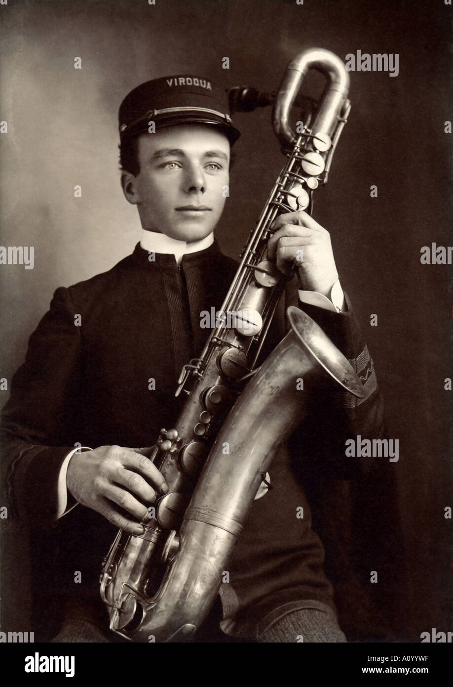 A young American bandsman with a large saxaphone Stock Photo - Alamy