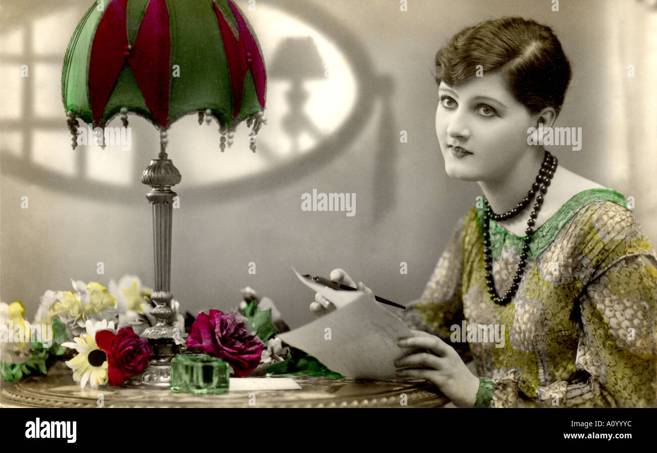 An attractive young lady writing a letter Stock Photo - Alamy